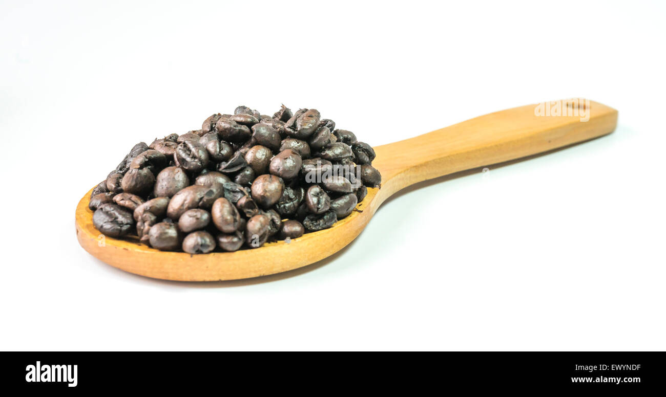 Coffee beans with wooden ladle Stock Photo - Alamy