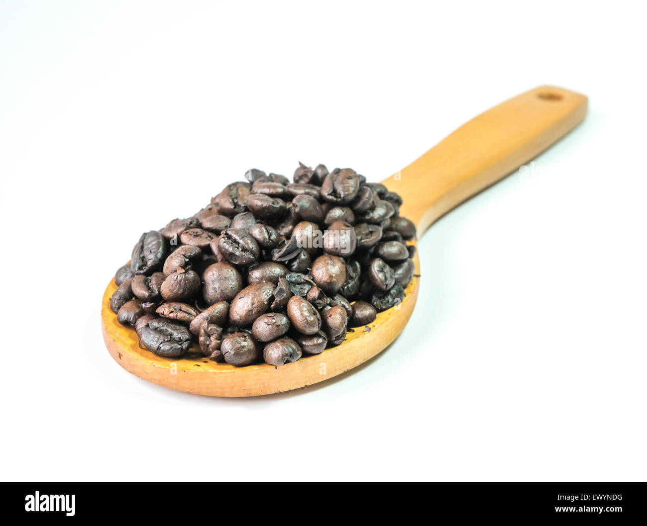 Coffee beans with wooden ladle Stock Photo - Alamy