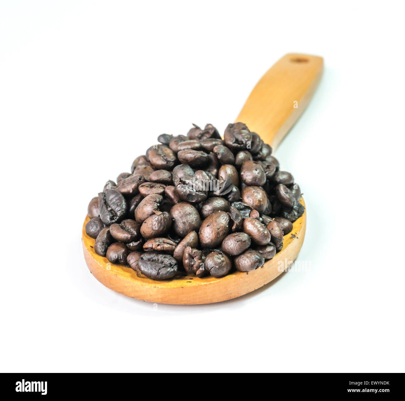 Coffee beans with wooden ladle Stock Photo - Alamy