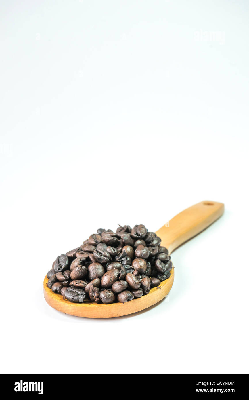 Coffee beans with wooden ladle Stock Photo - Alamy