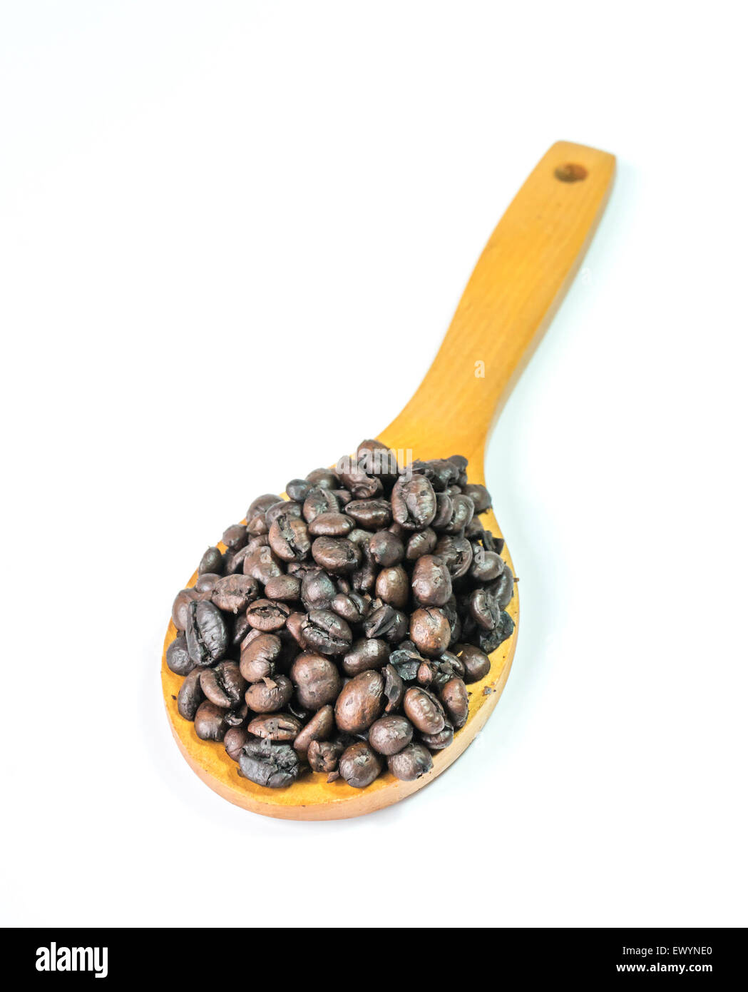 Coffee beans with wooden ladle Stock Photo - Alamy