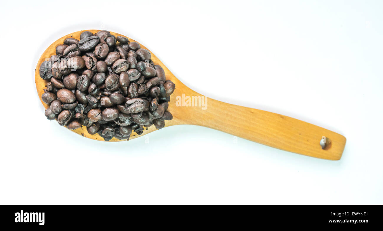 Coffee beans with wooden ladle Stock Photo - Alamy