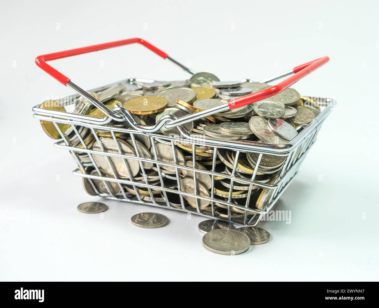 Coins inside basket Stock Photo - Alamy