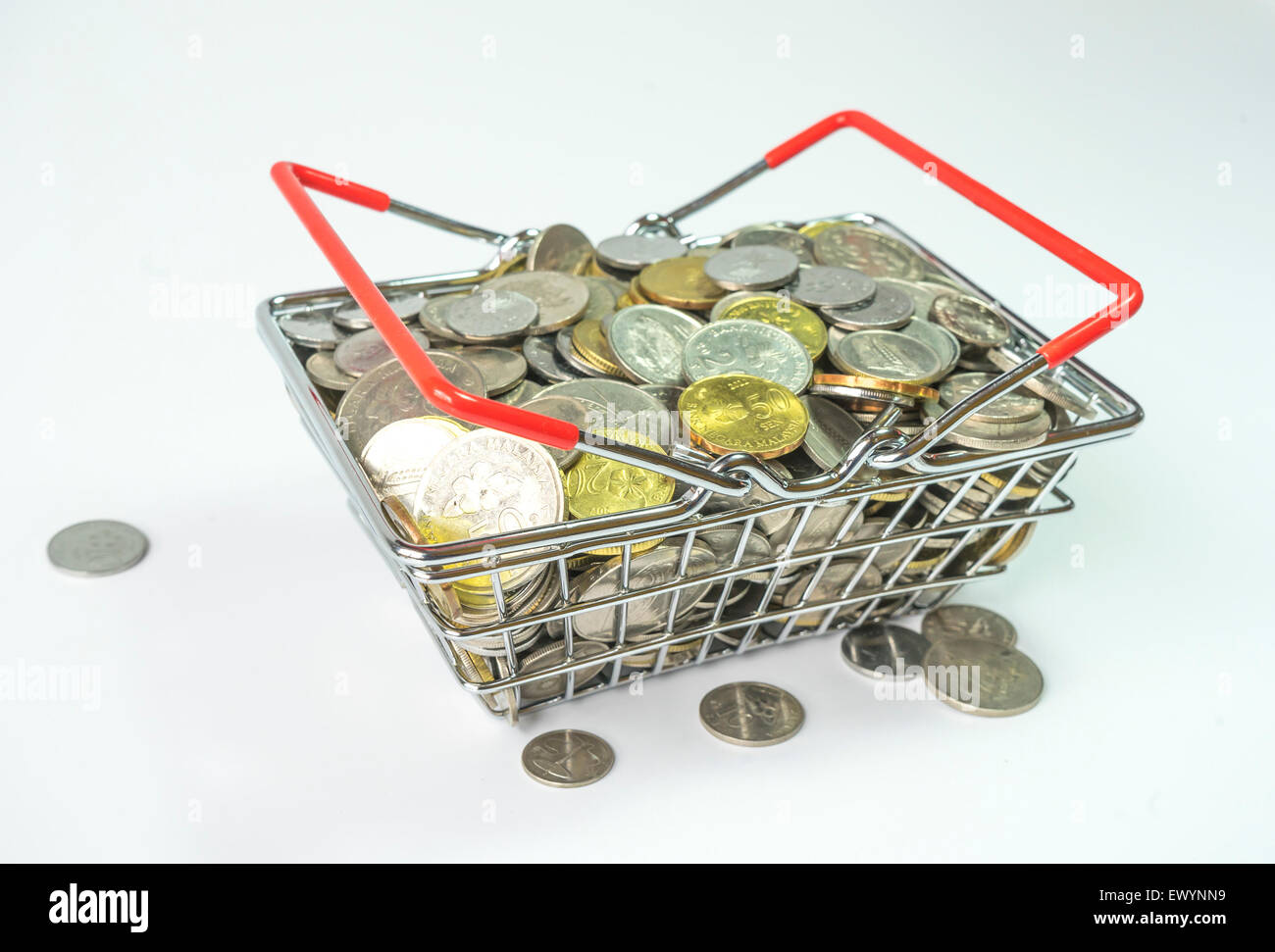 Coins inside basket Stock Photo - Alamy
