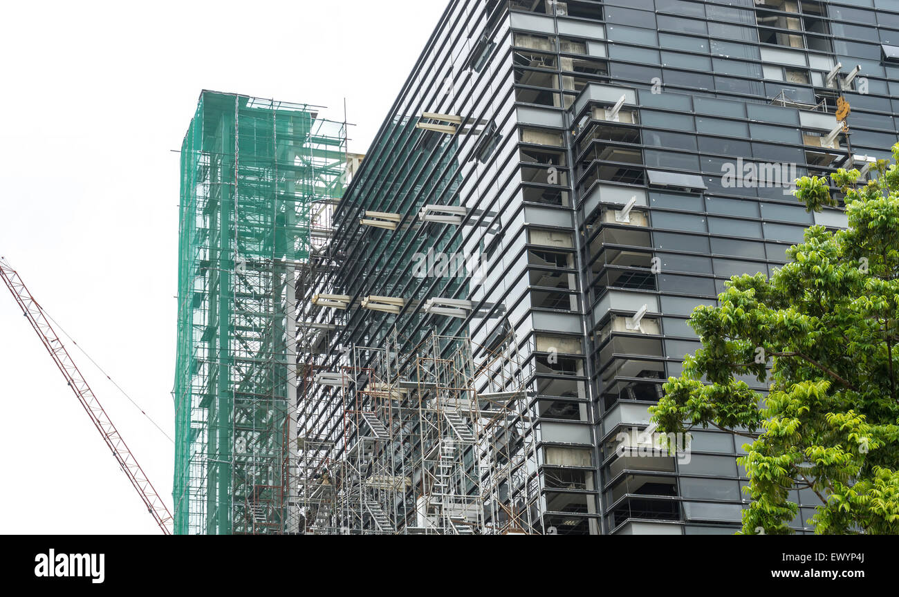 Glass building under construction stage Stock Photo - Alamy