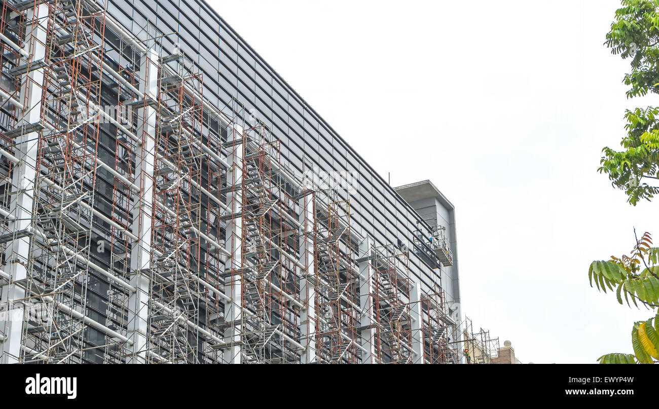 Glass building under construction stage Stock Photo - Alamy