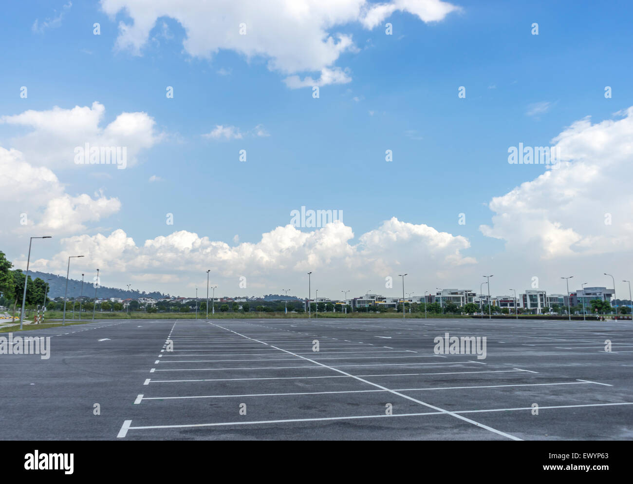 Empty parking lot with blue skies Stock Photo - Alamy