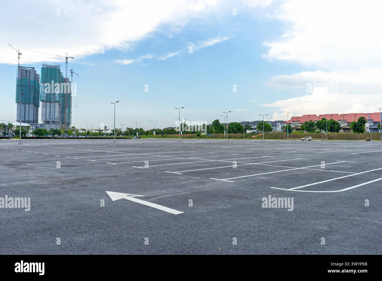 Empty parking lot with construction background Stock Photo - Alamy