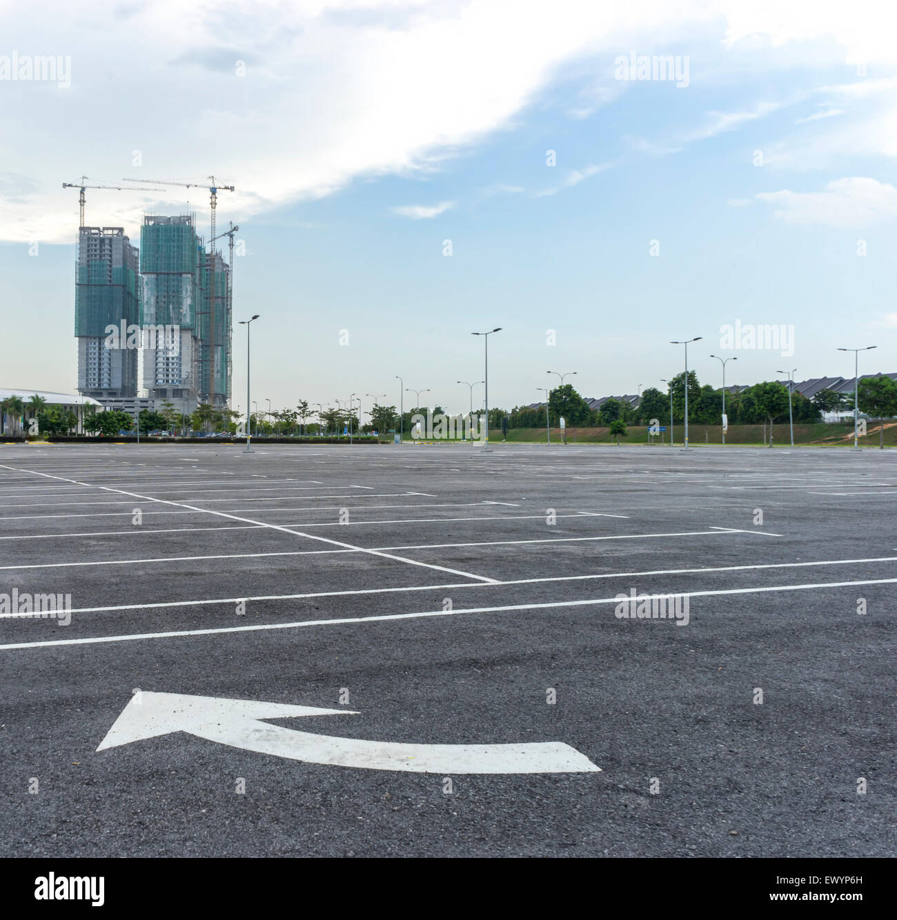 Empty parking lot with construction background Stock Photo - Alamy