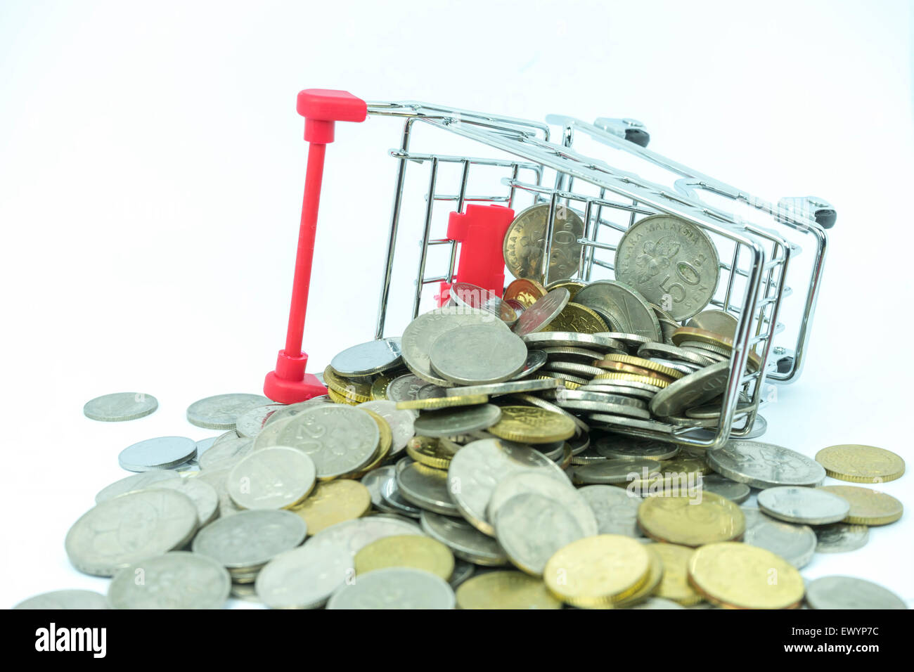 Toy trolley and coins with white background Stock Photo - Alamy