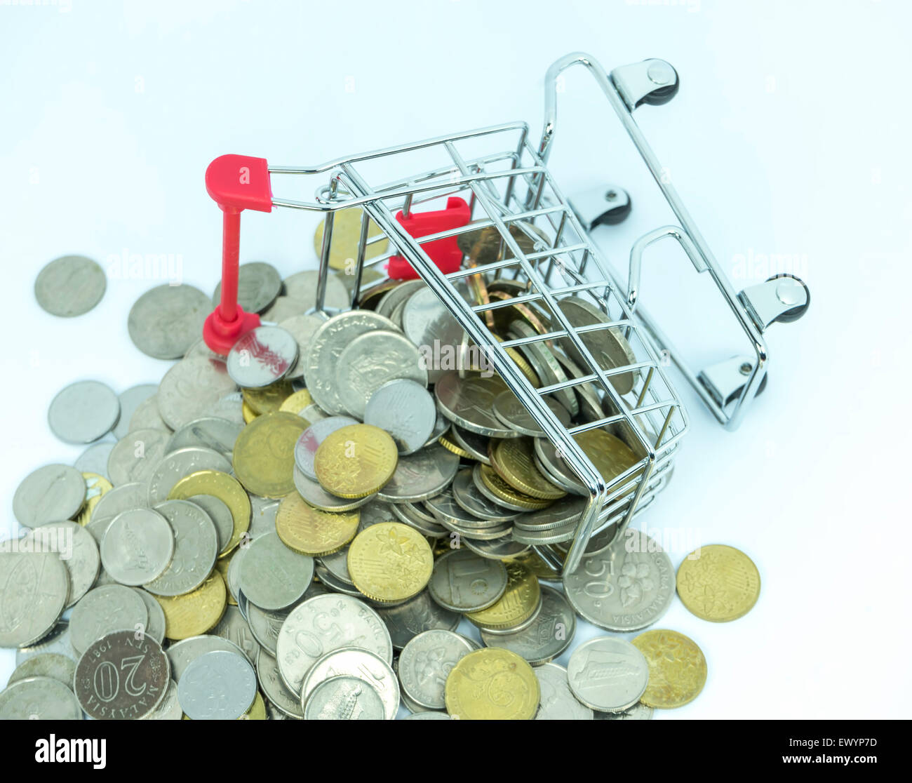 Toy trolley and coins with white background Stock Photo - Alamy