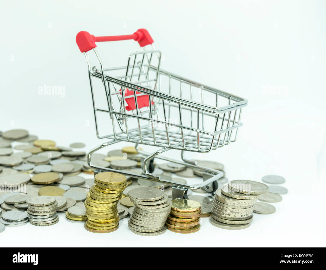 Coins and trolley with white background Stock Photo - Alamy