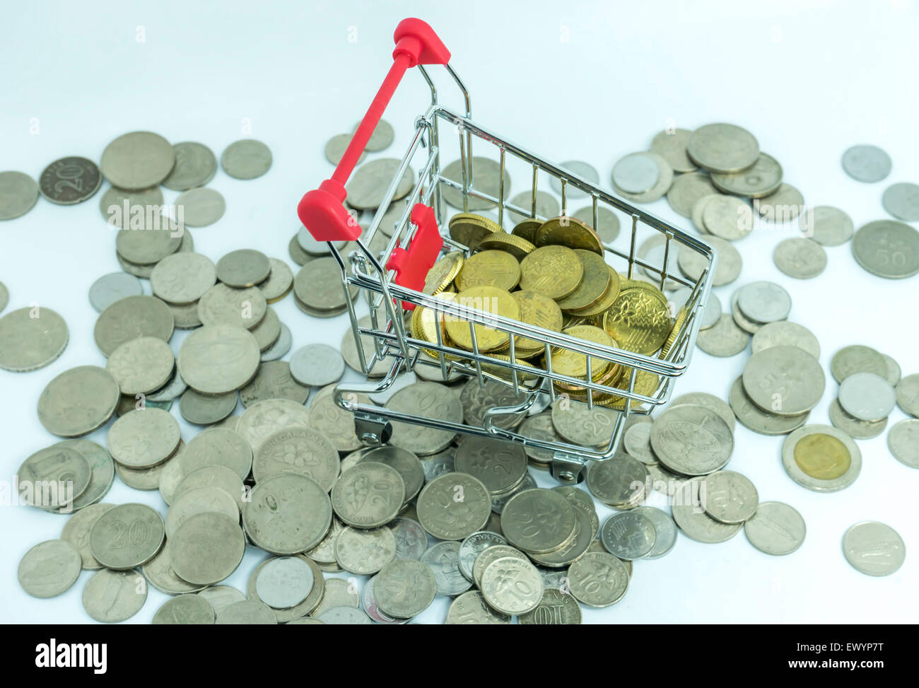 Coins and trolley with white background Stock Photo - Alamy