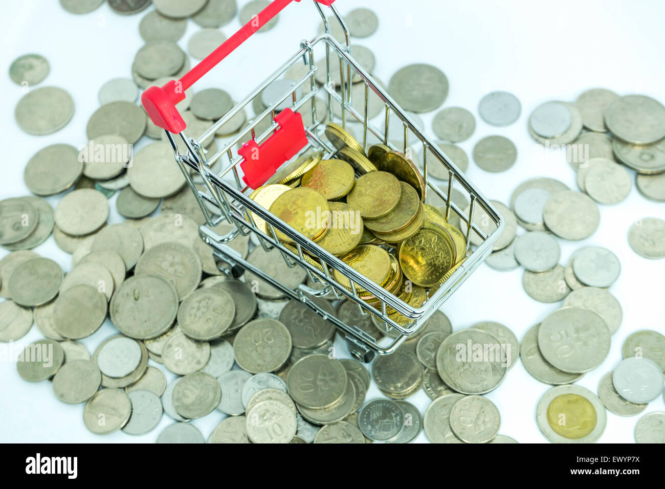 Coins and trolley with white background Stock Photo - Alamy