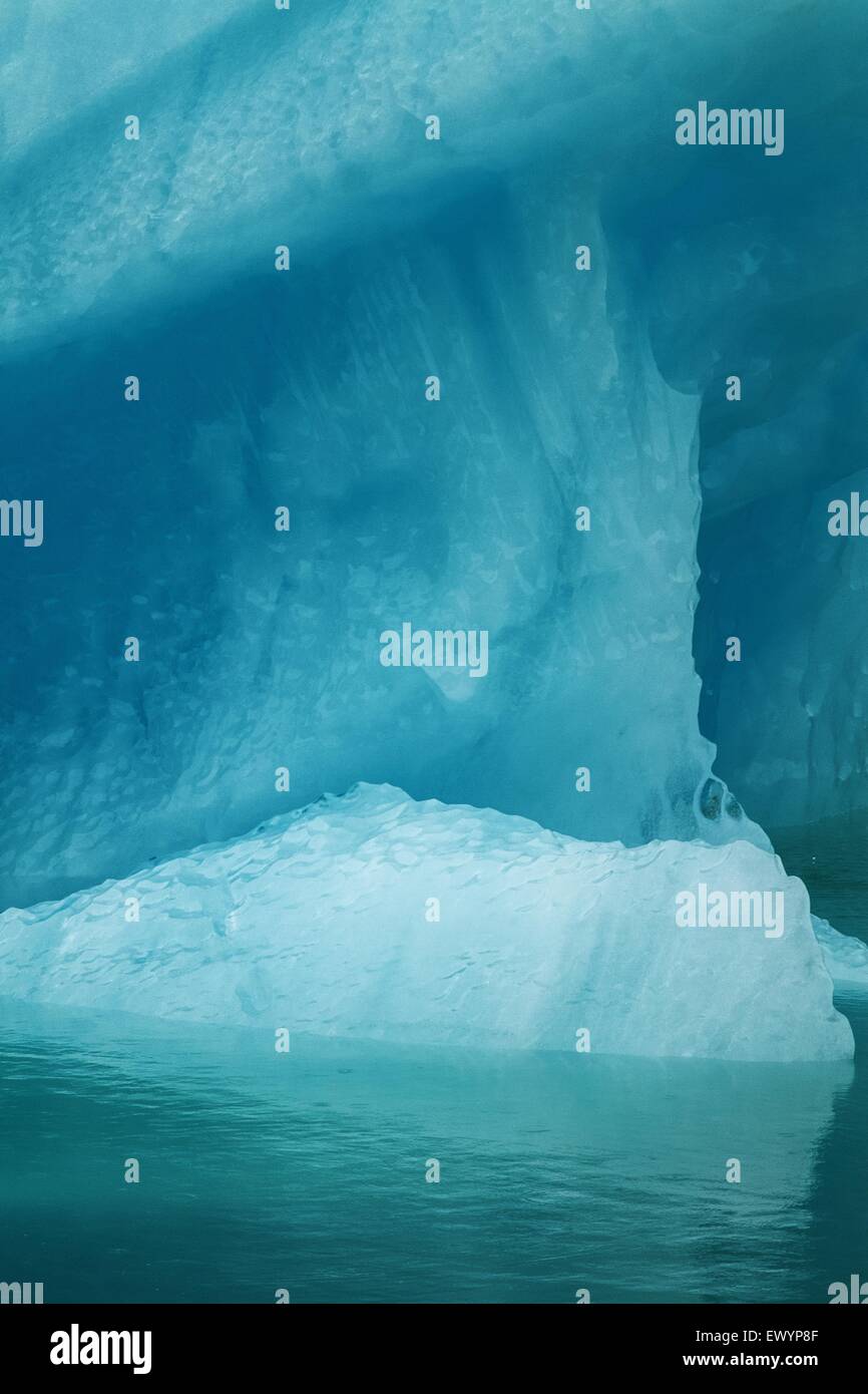 Detail of big turquoise iceberg floating on the water in Alaska with ...