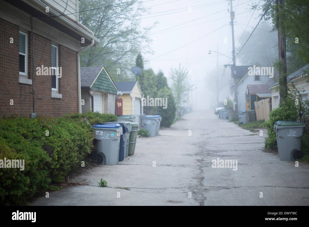 A foggy urban landscape at dusk in an alley Stock Photo - Alamy
