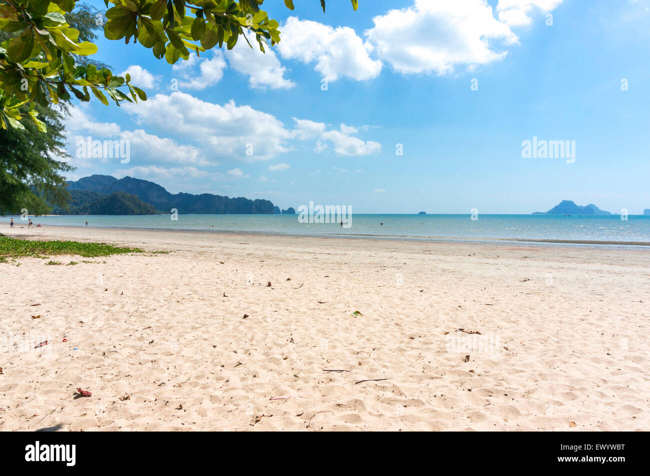 Yellow sand at tropical beach with blue skies Stock Photo - Alamy