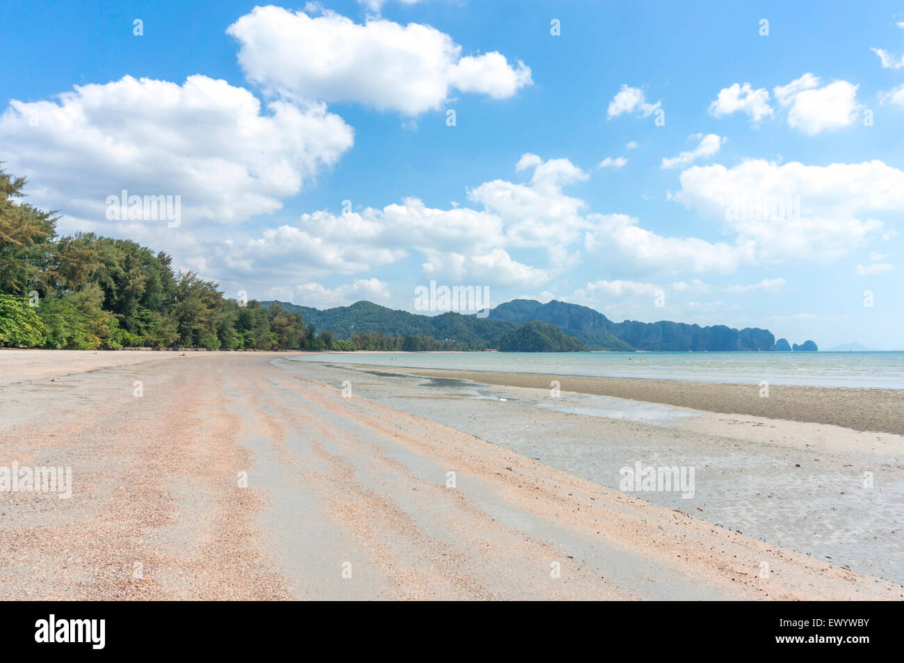 Yellow sand at tropical beach with blue skies Stock Photo - Alamy