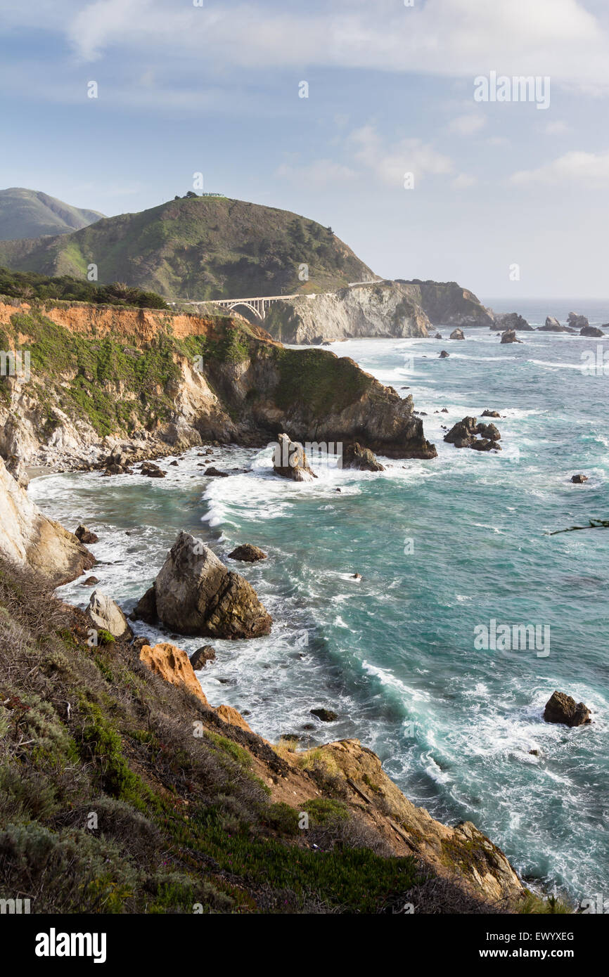 dramatic landscape of the California coast with waves splashing on the ...