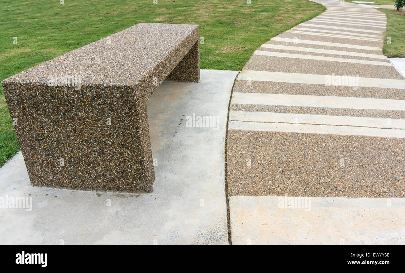 Bench at pedestrian walkway Stock Photo - Alamy