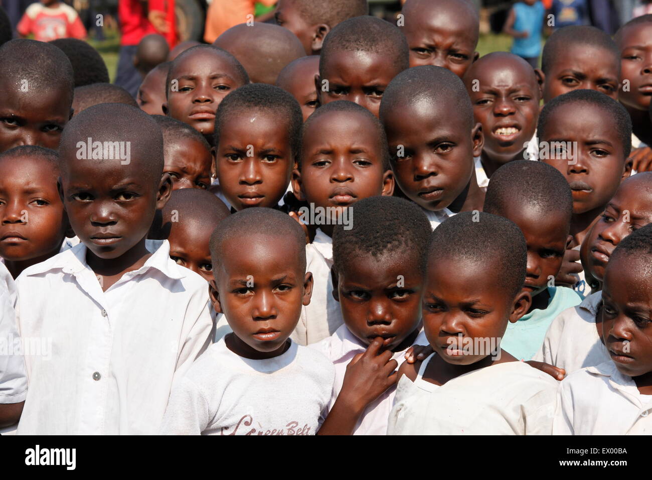 Group of students in schoolyard during morning assembly, Kasongo-Lunda ...