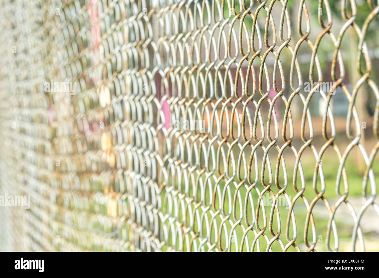 Iron chain fence with blurred background Stock Photo - Alamy
