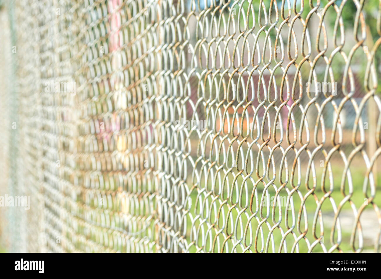 Iron chain fence with blurred background Stock Photo - Alamy