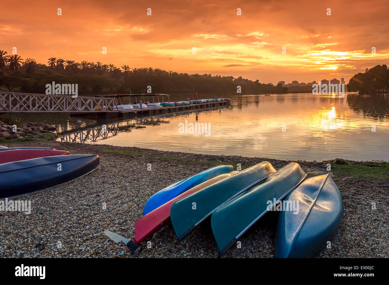 Canoe with sunset background Stock Photo - Alamy