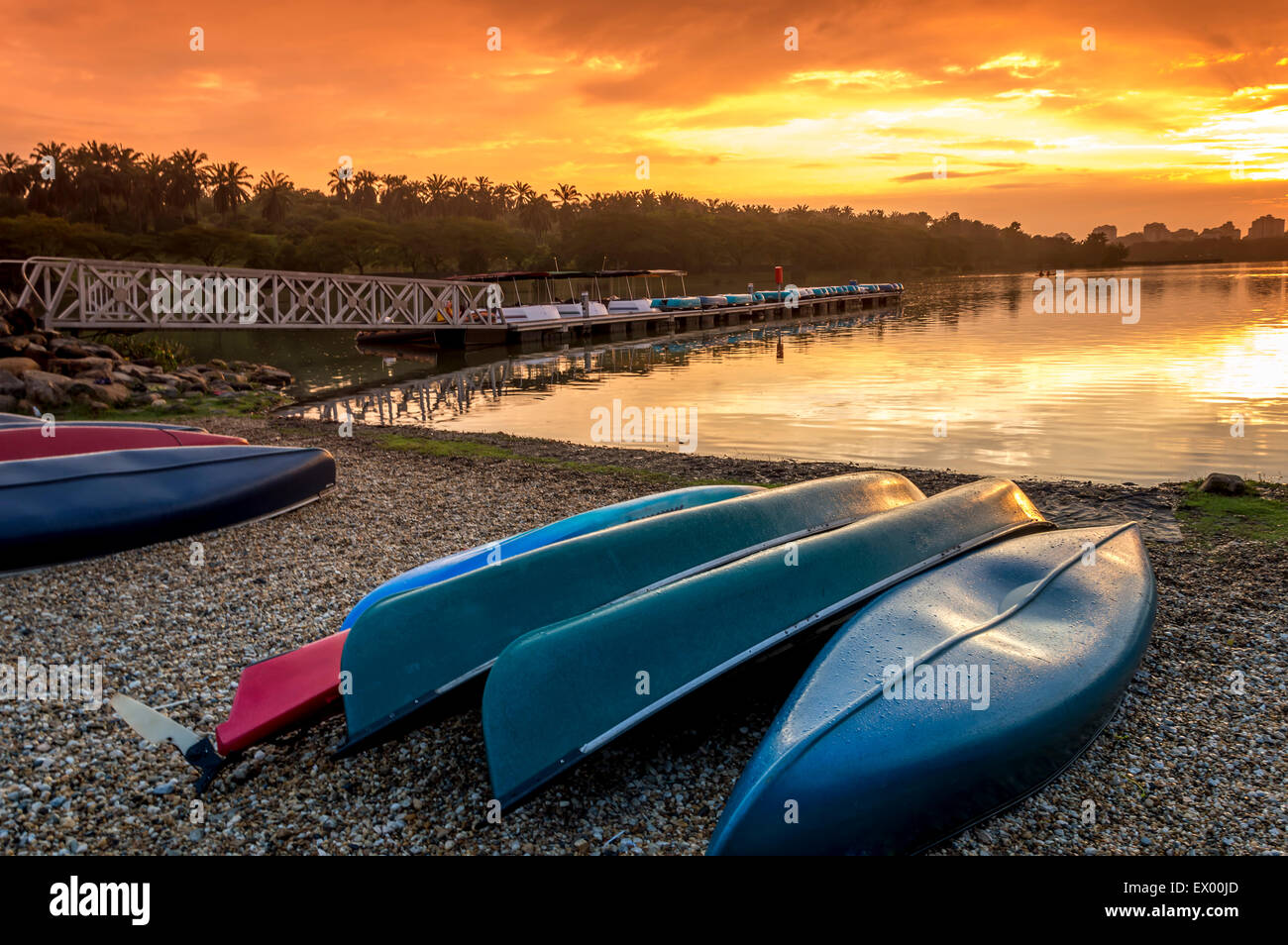 Canoe with sunset background Stock Photo - Alamy