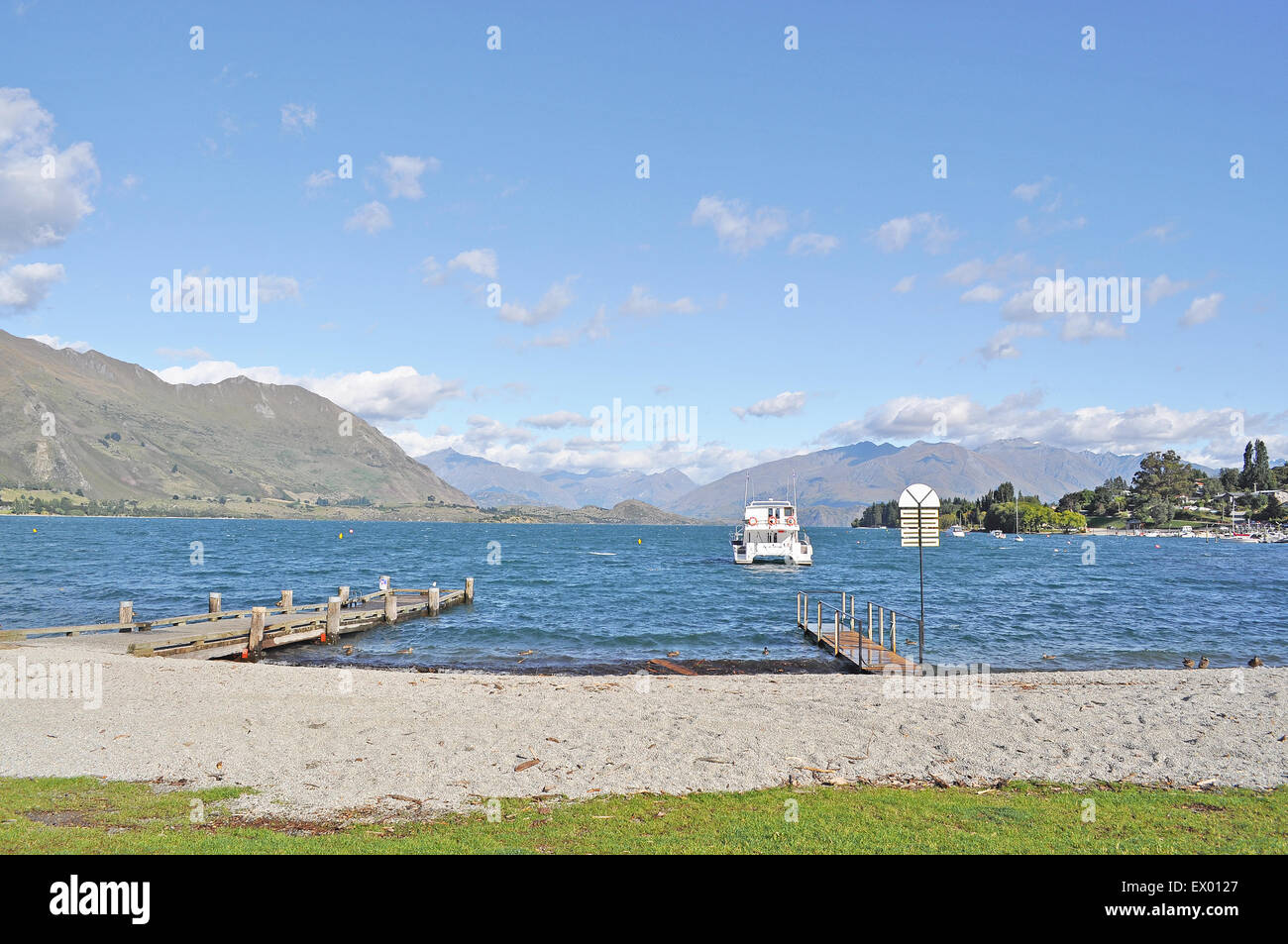 Wooden jetty with mountain background Stock Photo - Alamy