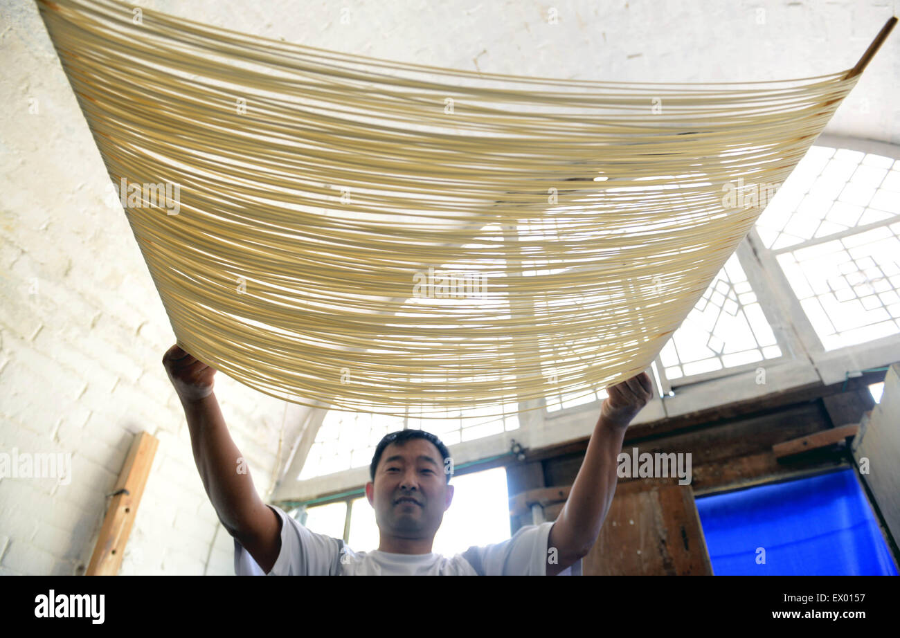 Yan'an, China's Shaanxi Province. 1st July, 2015. Zhang Zhuhe makes ...