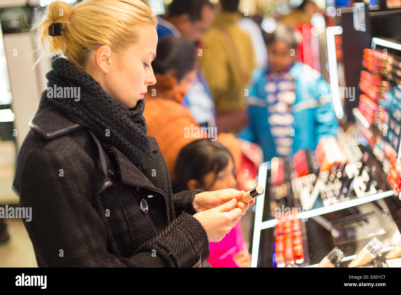 Beautiful woman shopping in beauty store Stock Photo - Alamy