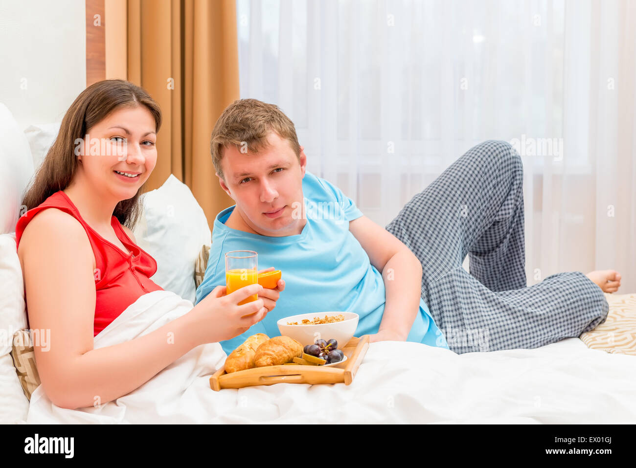 Women eating croissant smiling hi-res stock photography and images - Alamy
