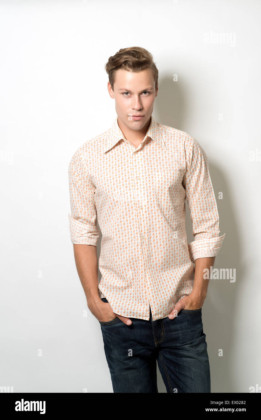 A handsome man, male model posing against white background Stock Photo ...