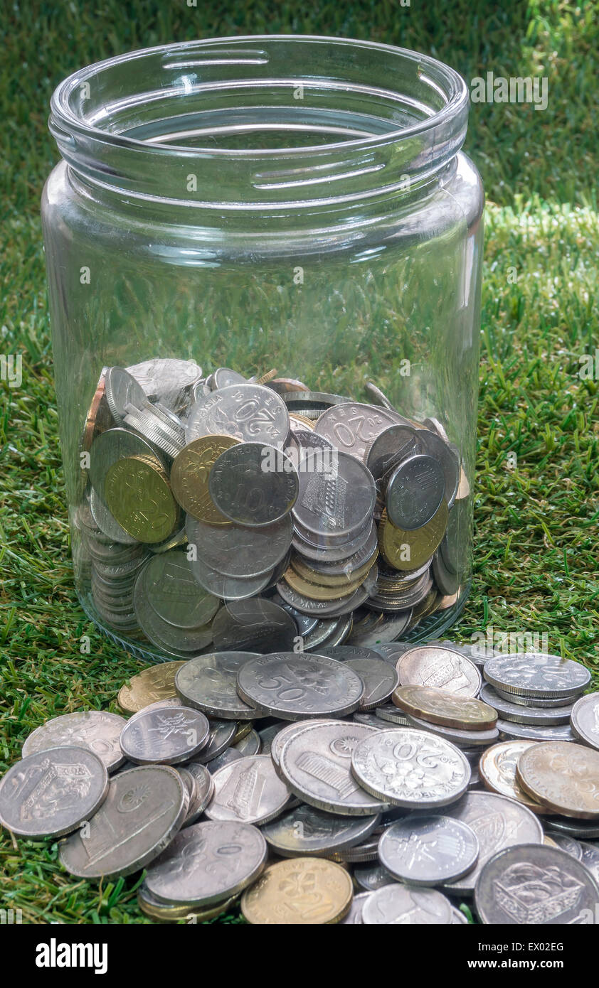 coins inside glass jar Stock Photo - Alamy