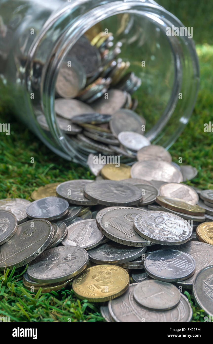 coins inside glass jar Stock Photo - Alamy