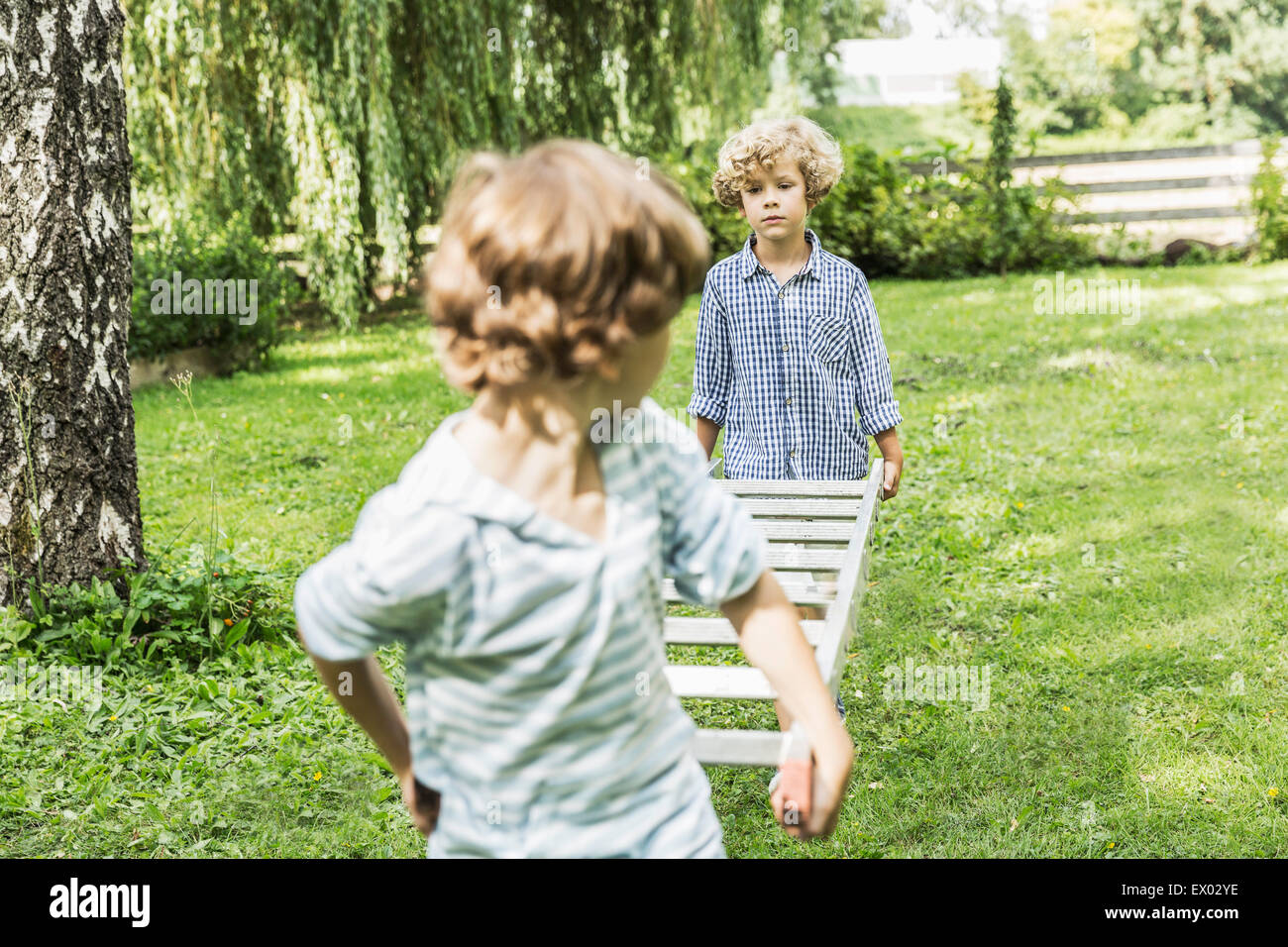 Two boys carrying hi-res stock photography and images - Alamy