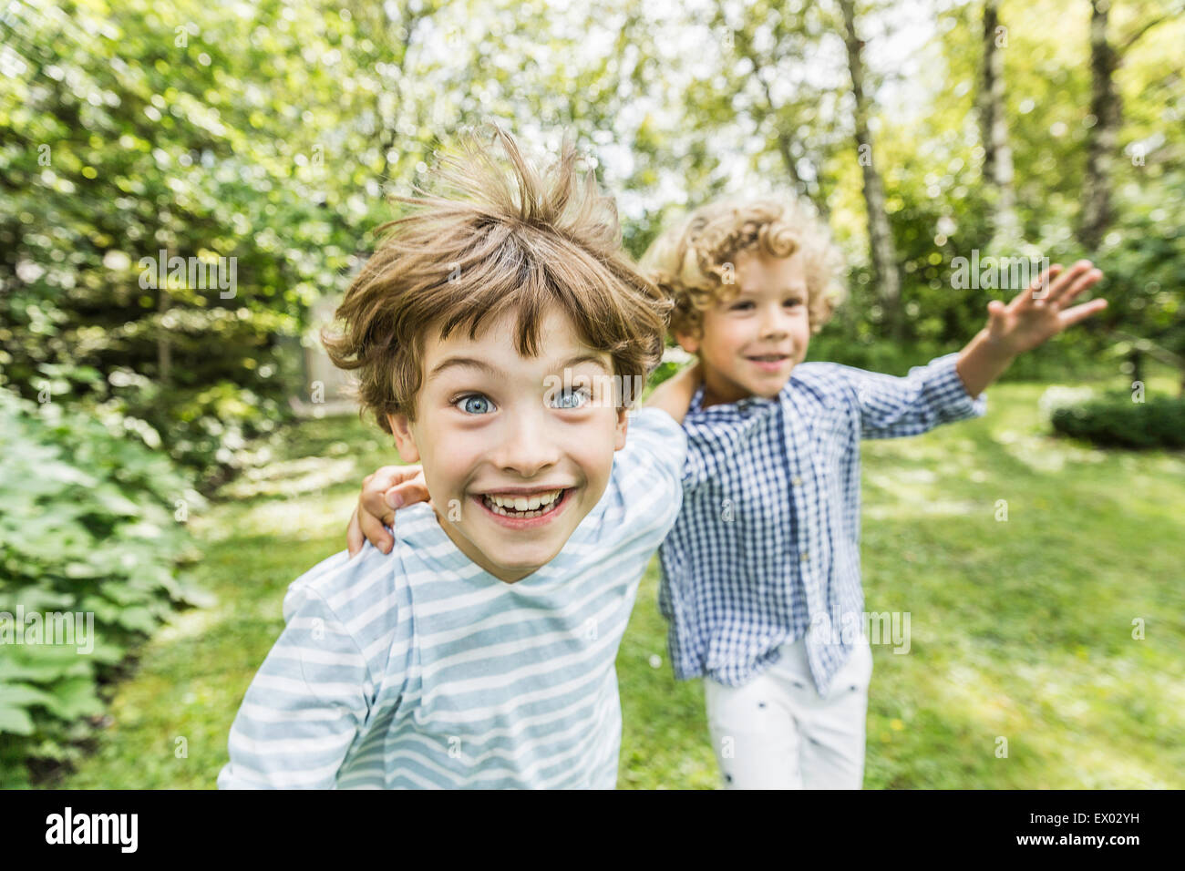Children running hi-res stock photography and images - Alamy