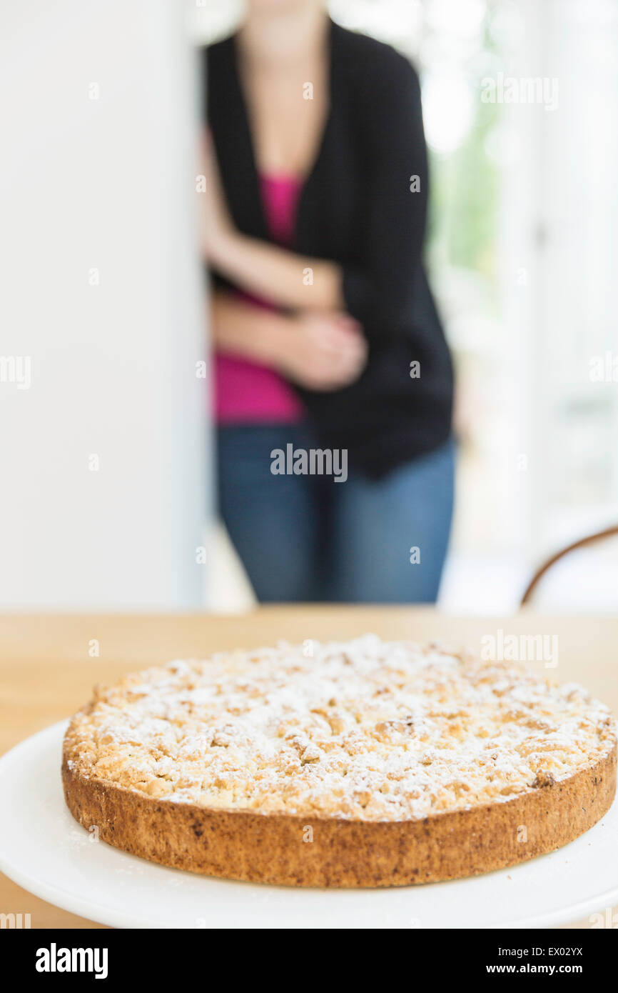 Freshly baked cake on kitchen table Stock Photo - Alamy