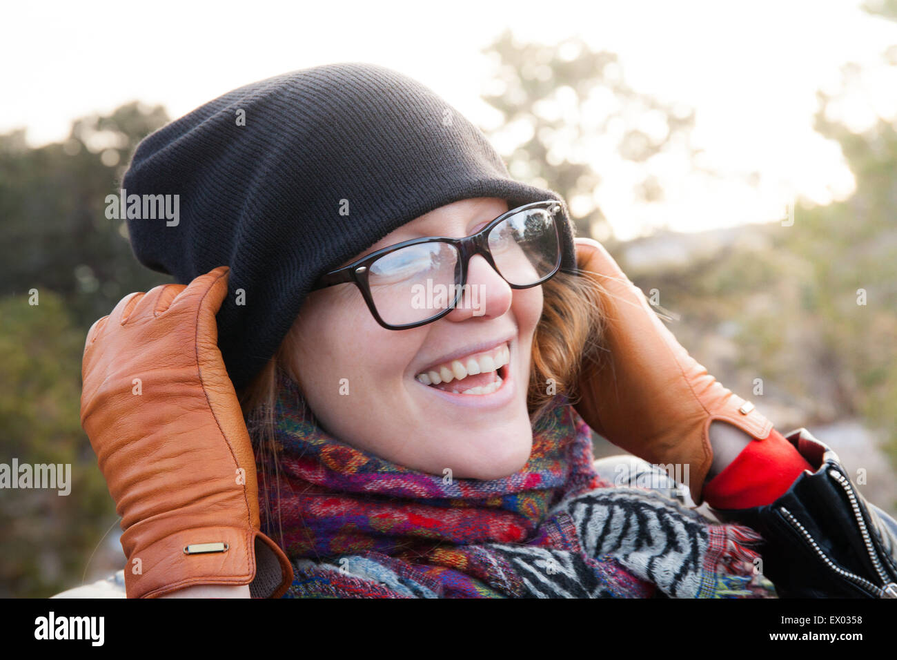 Close up of woman wearing knit hat and scarf Stock Photo - Alamy