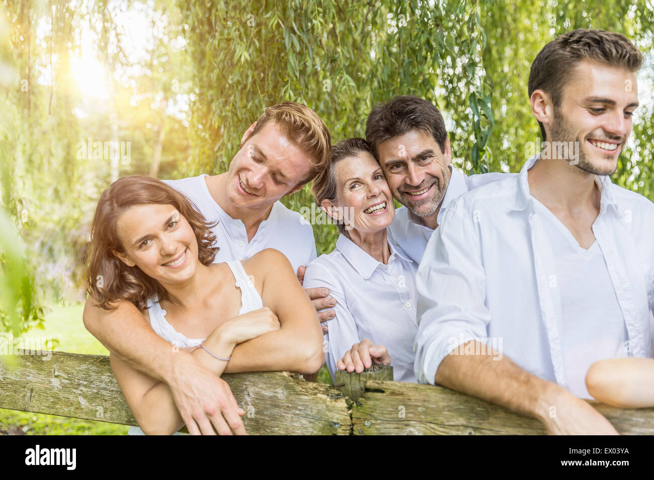 Senior woman leaning against tree hi-res stock photography and images ...