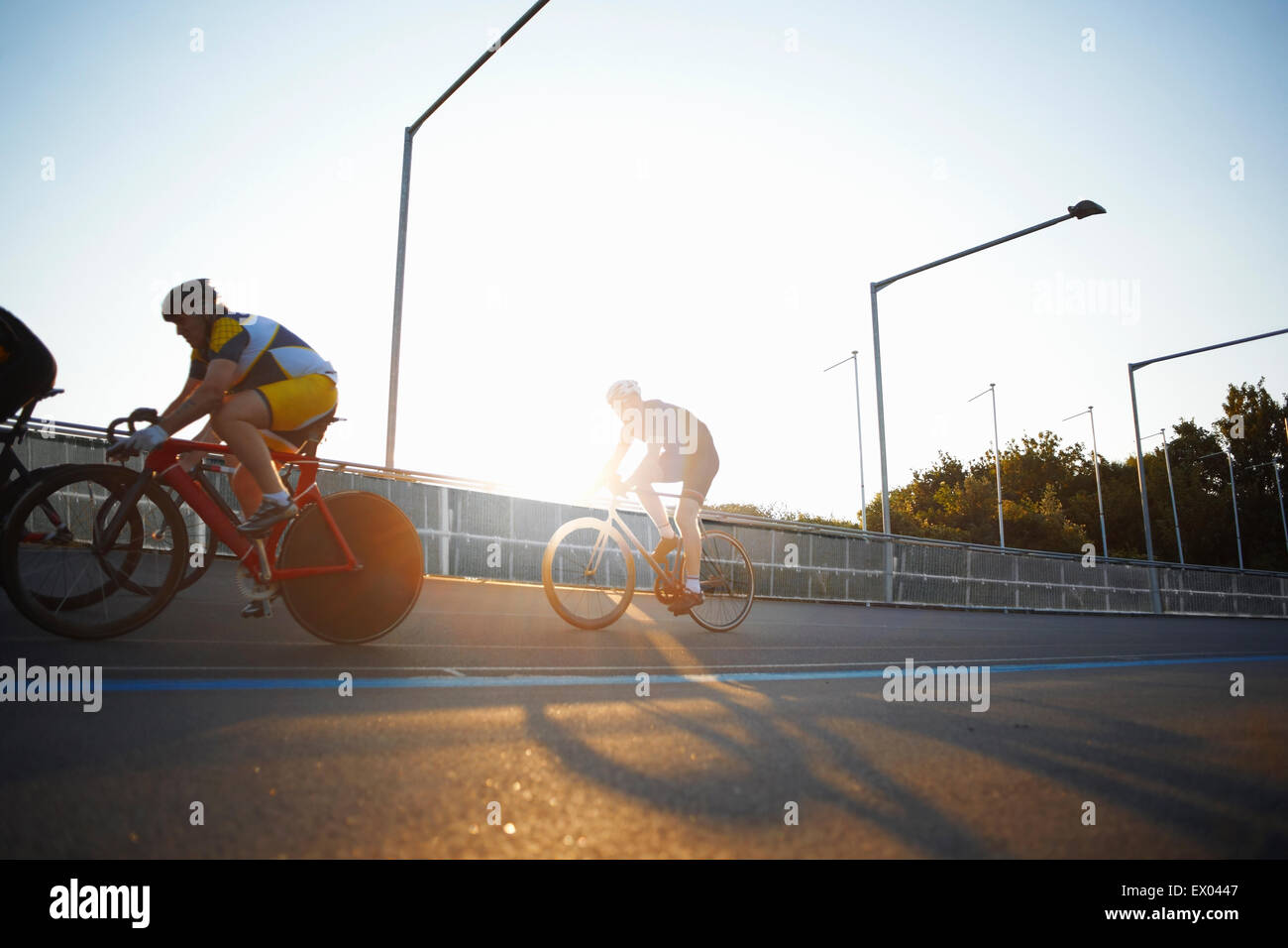 Cyclists cycling on track at velodrome, outdoors Stock Photo - Alamy
