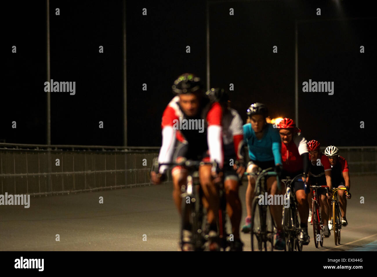 Cyclists cycling on track at velodrome, outdoors Stock Photo - Alamy