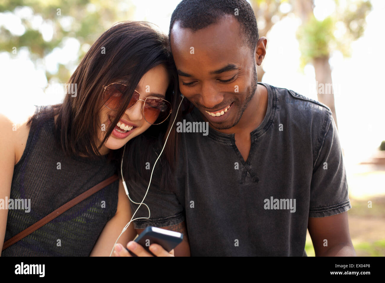 Female male sharing earphones hi-res stock photography and images - Alamy