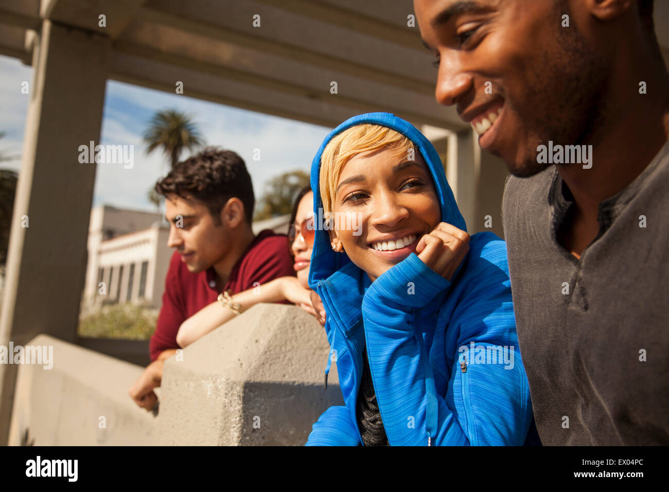 Group of friends sitting together, outdoors Stock Photo - Alamy