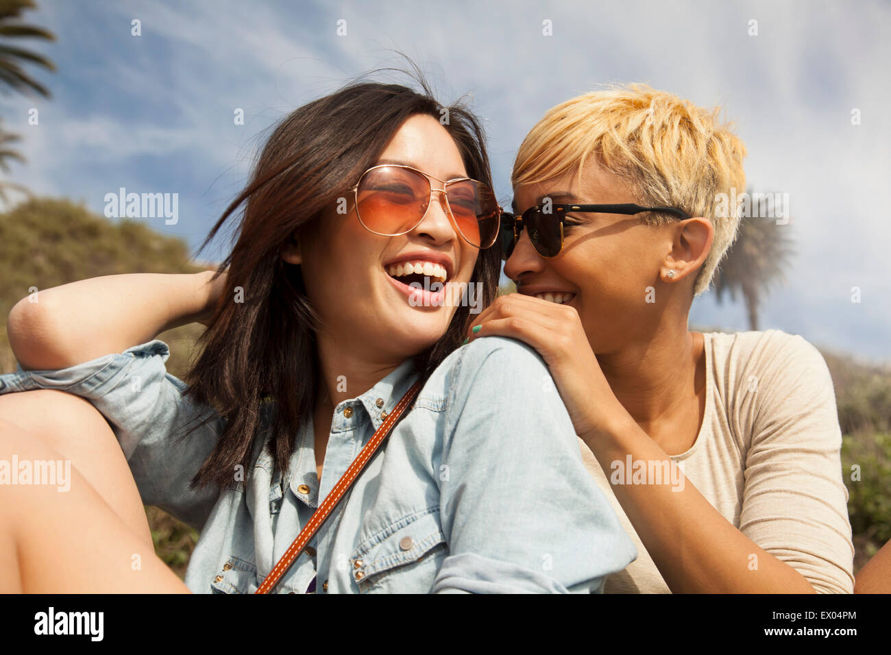 Two female friends, outdoors, laughing together Stock Photo - Alamy
