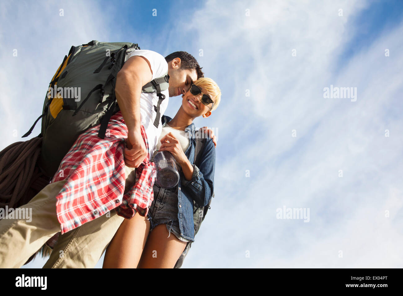 Young couple, outdoors, flirting, low angle view Stock Photo - Alamy