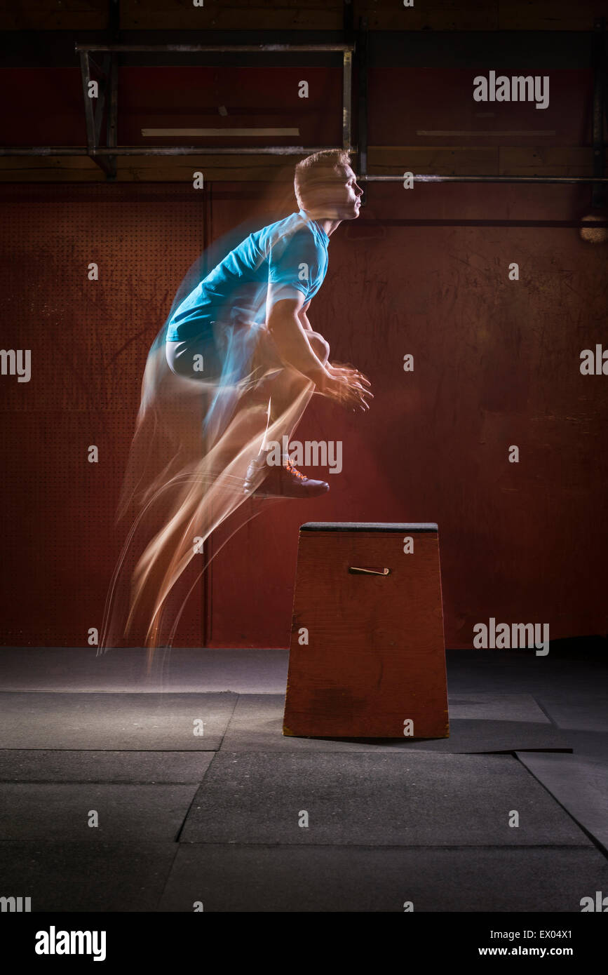 Man jumping onto vaulting horse Stock Photo - Alamy