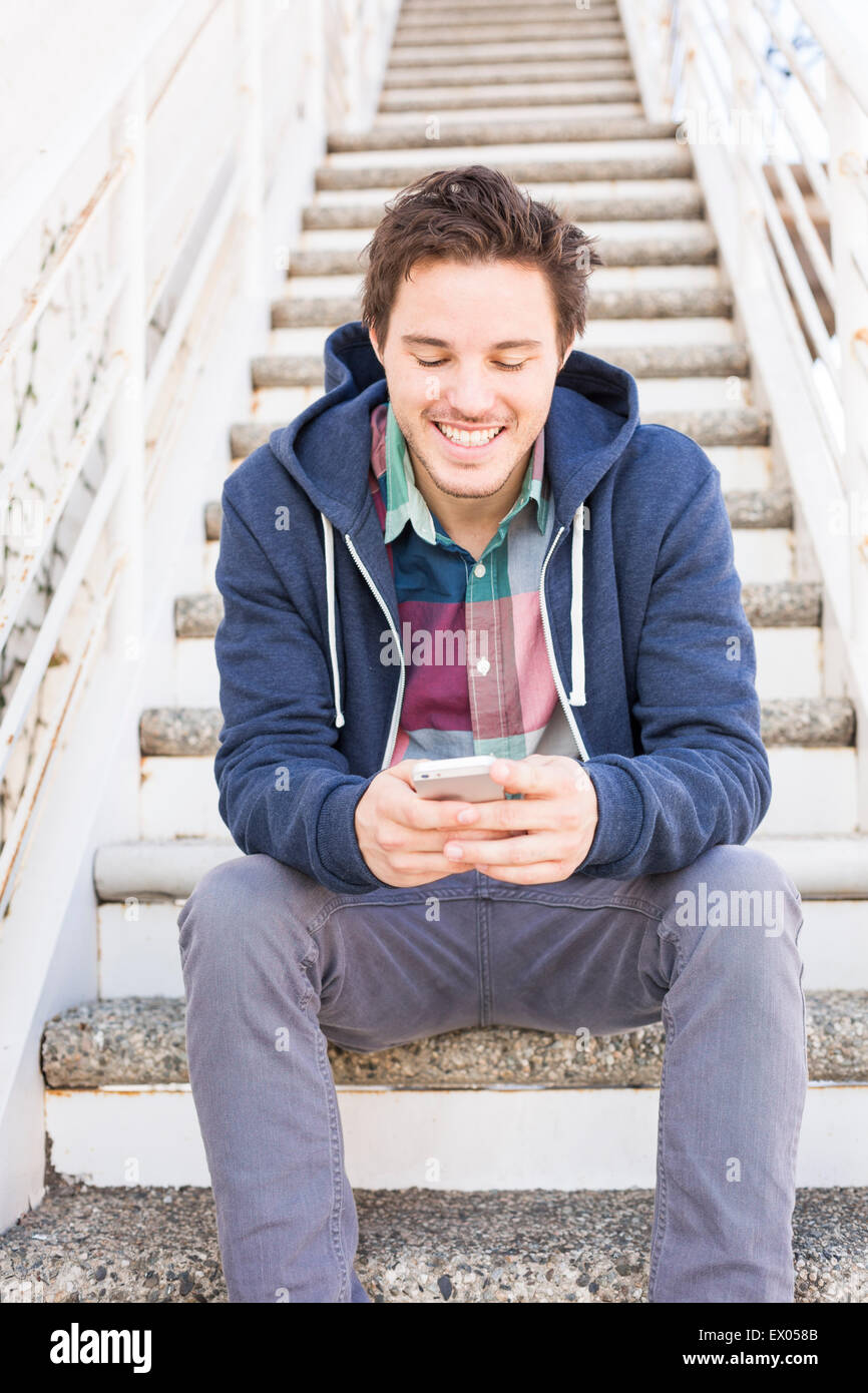 Sitting on steps hi-res stock photography and images - Alamy