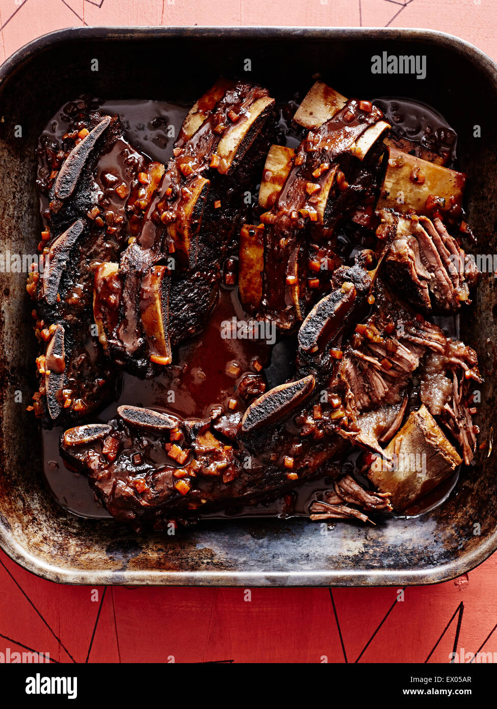 Roasting tin of short ribs braised in black sauce Stock Photo - Alamy